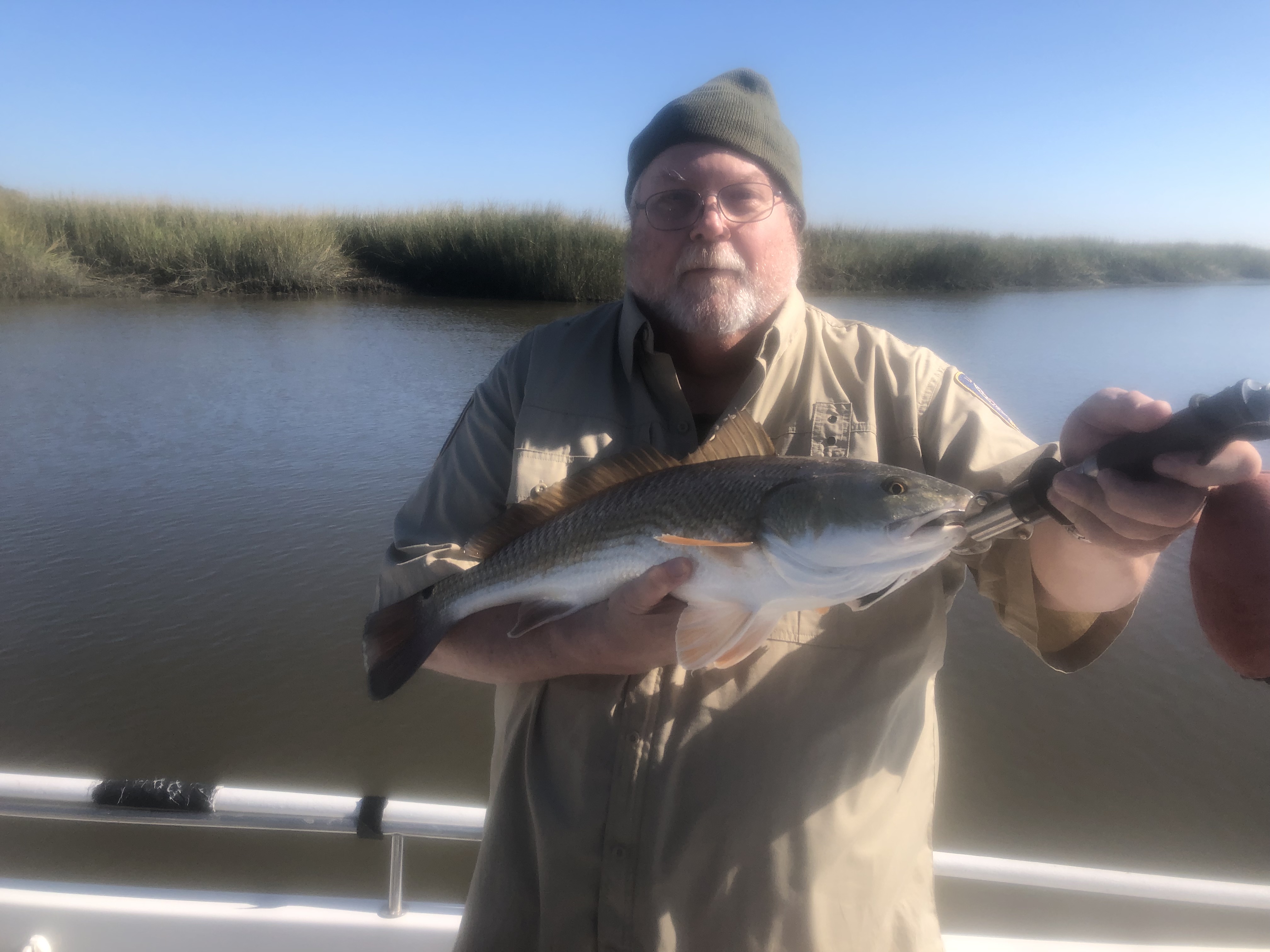 Jim Sattler with a nice red. Jim caught several nice reds and sea trout ...